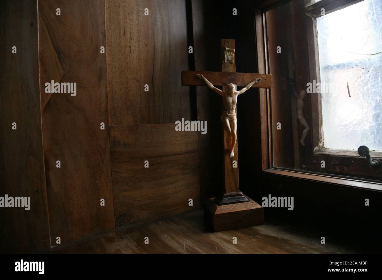 Cross at the window Stock Photo - Alamy
