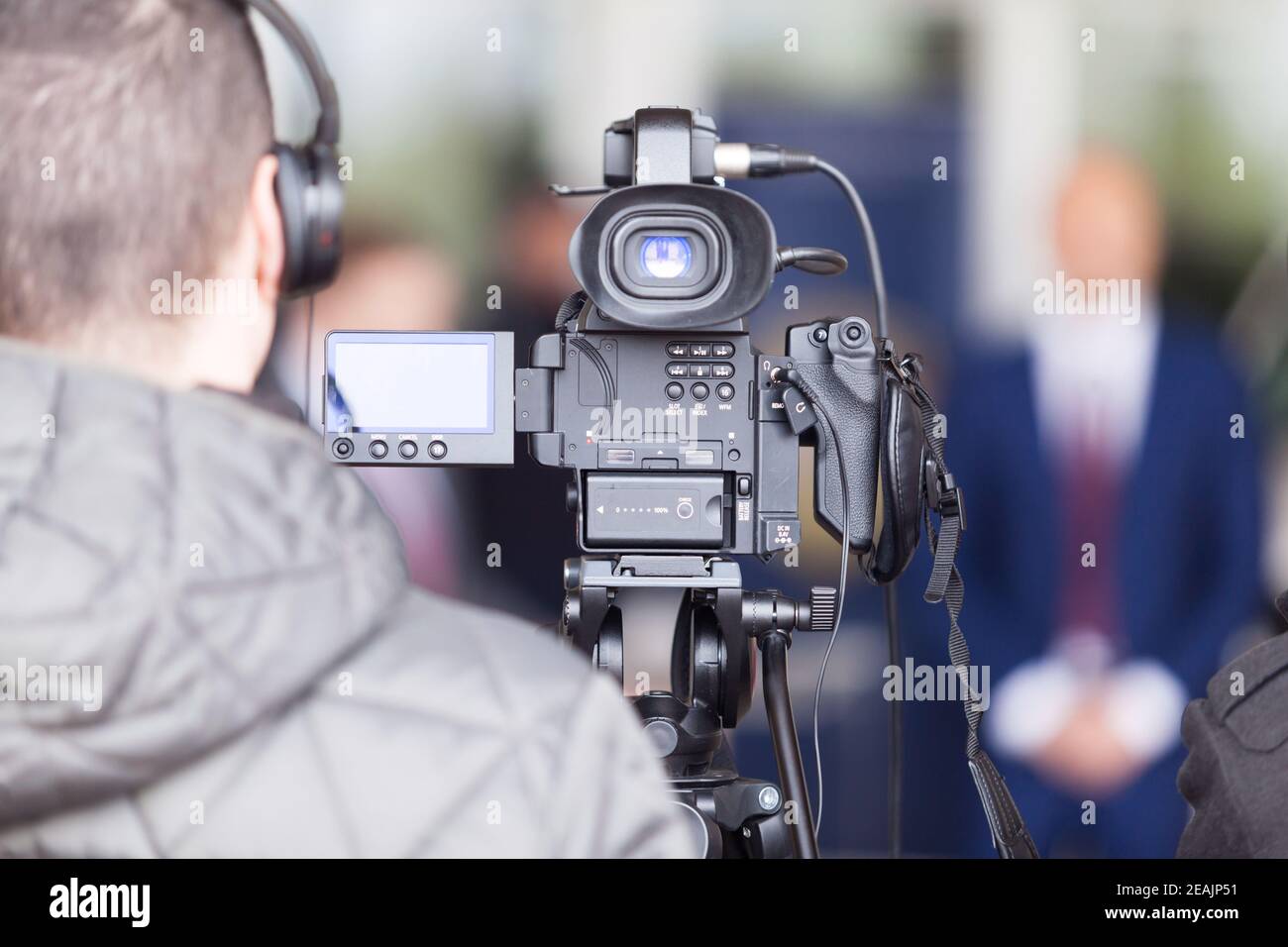 Professional video camera operator working his equipment video hi-res ...