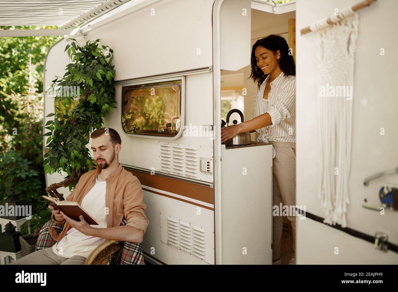 Love couple in rv, adventure on wheels, camping Stock Photo - Alamy