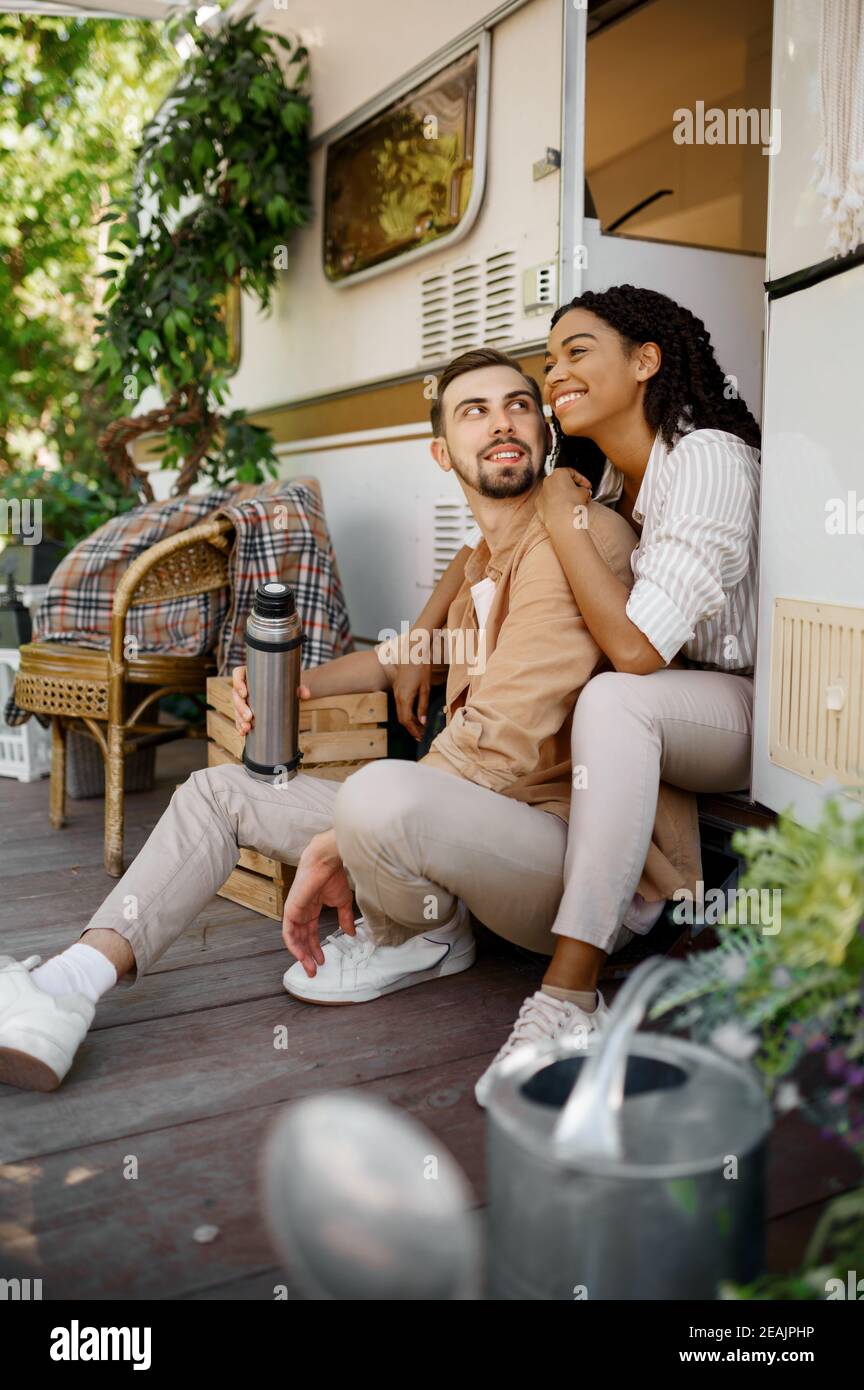 Couple with thermos in rv, camping in a trailer Stock Photo - Alamy