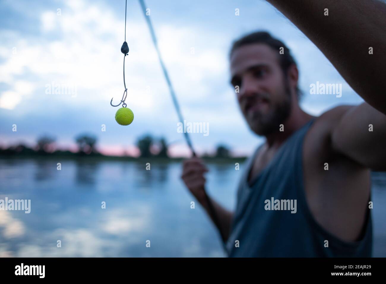 Angler using a pop up rig for carp fishing Stock Photo - Alamy