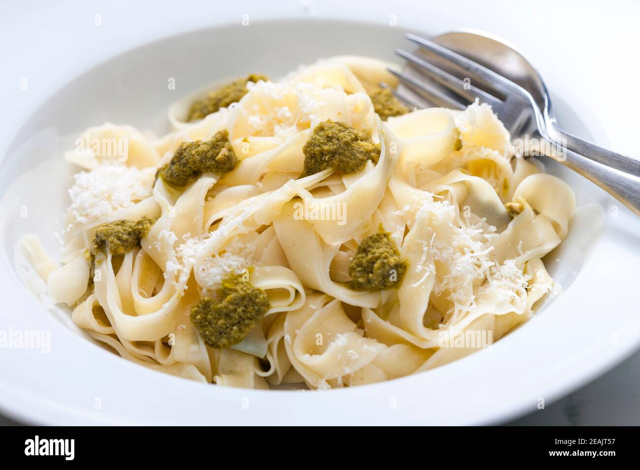pasta tagliatelle with green pesto Stock Photo - Alamy