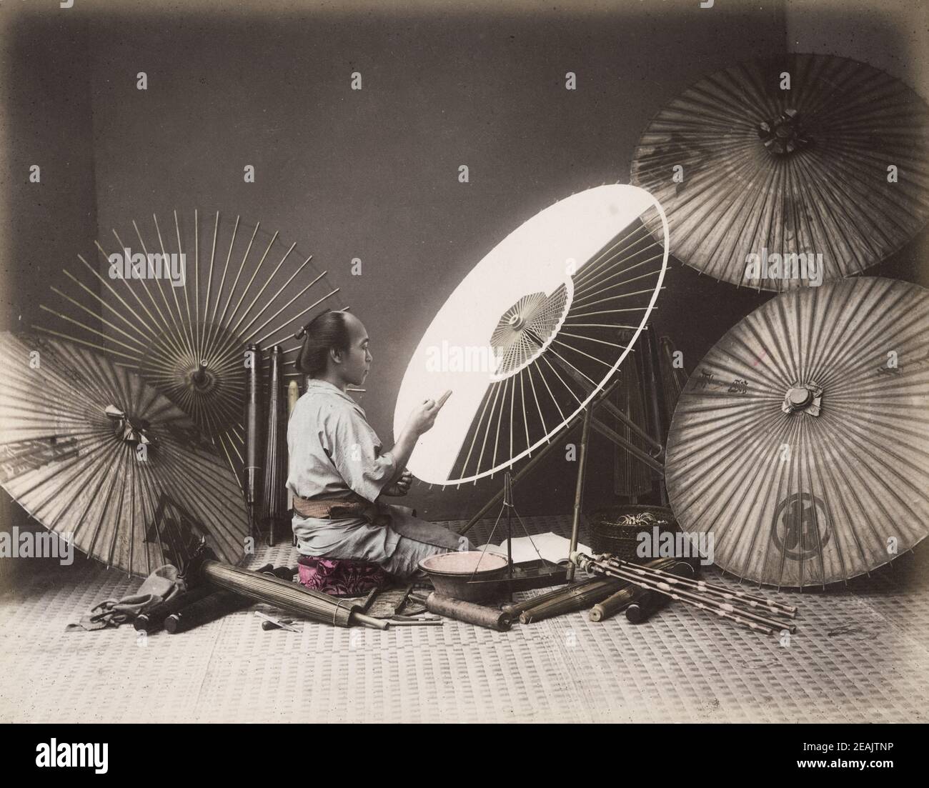 Late 19th century photograph - Umbrella and parasol maker, Japan Stock ...