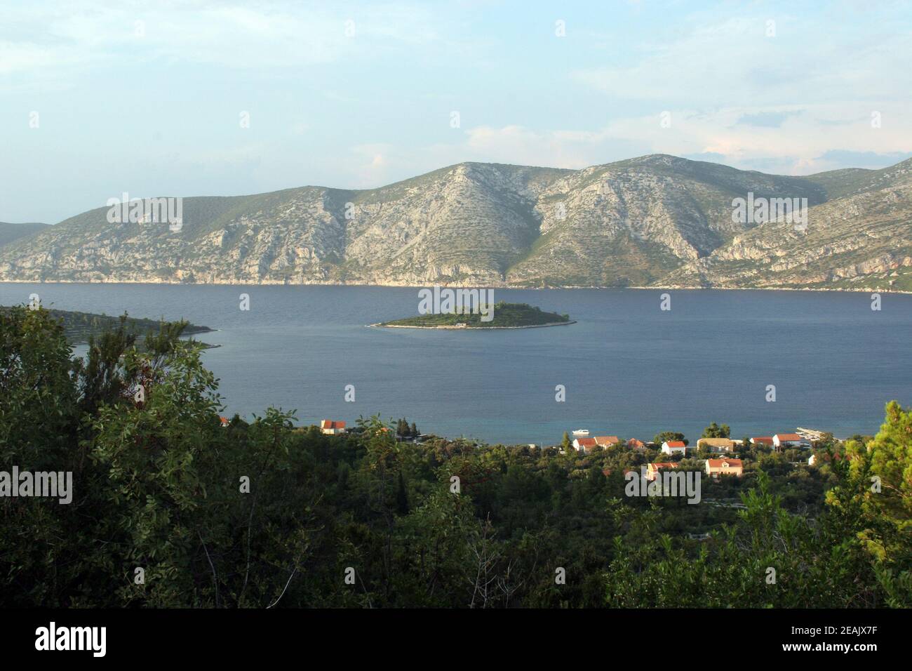 Island in the blue sea Stock Photo - Alamy