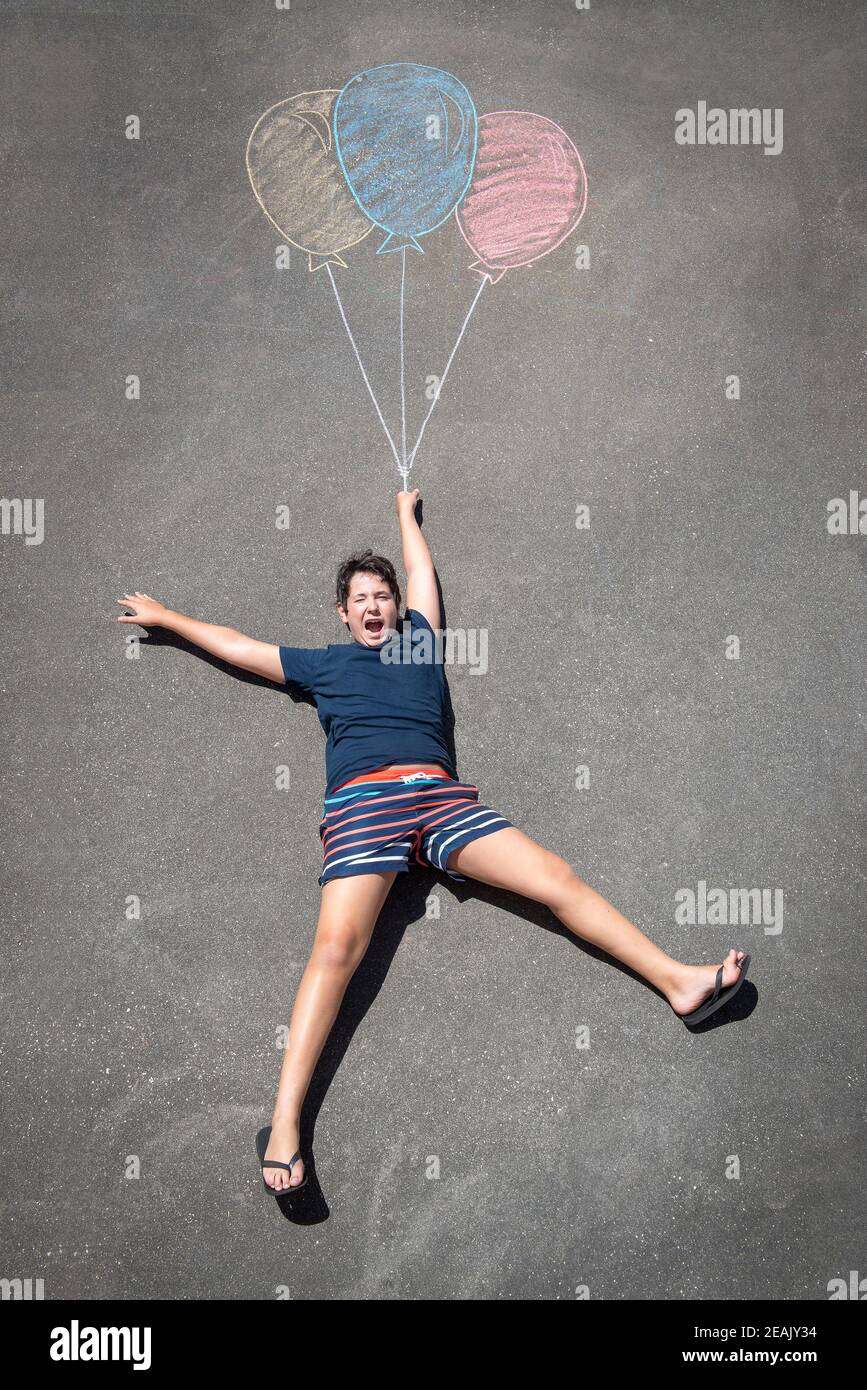 Happy boy with balloons hi-res stock photography and images - Alamy