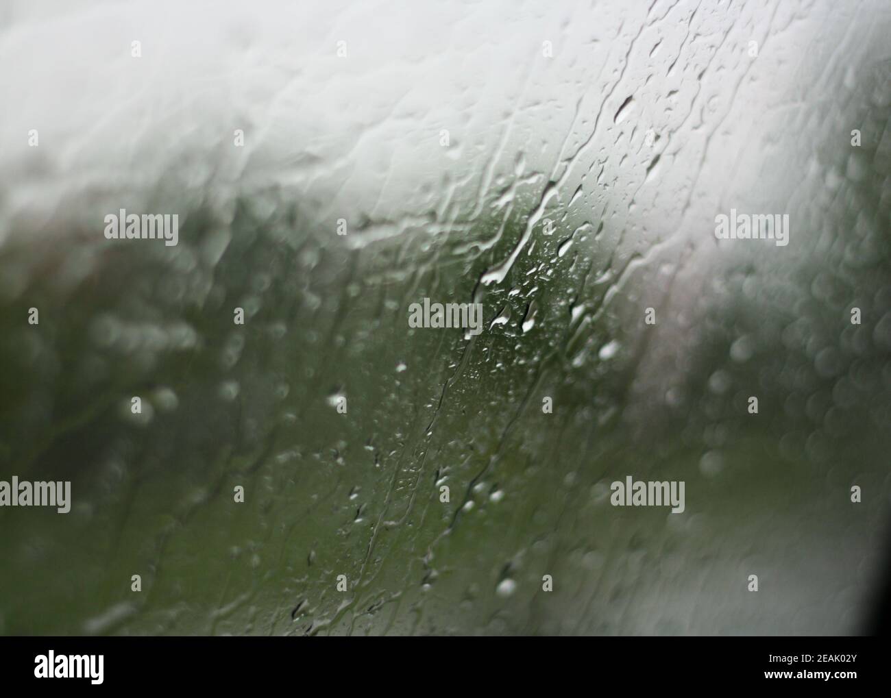 Rain on the window of the car - close of water Stock Photo - Alamy