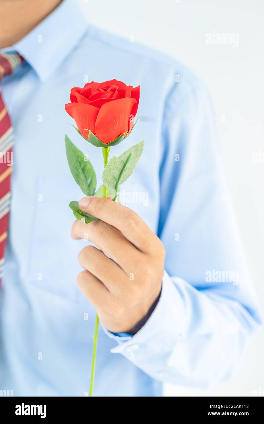 Man red rose in hand hi-res stock photography and images - Alamy