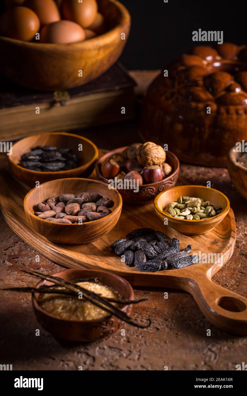 Different baking ingredients, spices and kitchen utensils in vintage ...