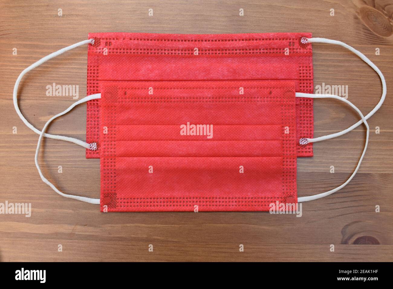 Large and Small Red Surgical Masks Stock Photo - Alamy