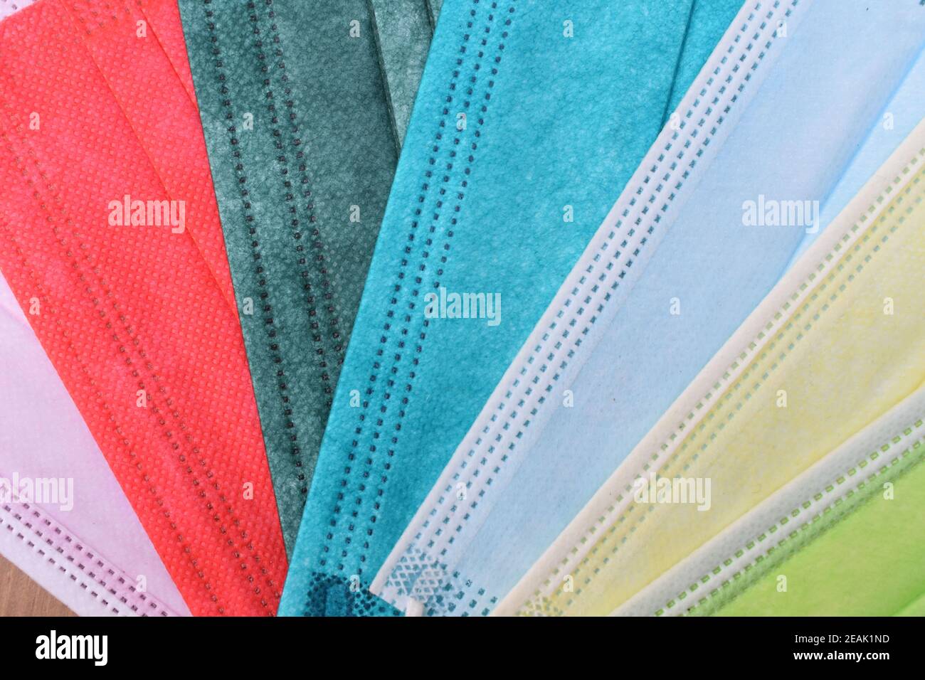 Seven surgical masks in various colours close up hi-res stock ...