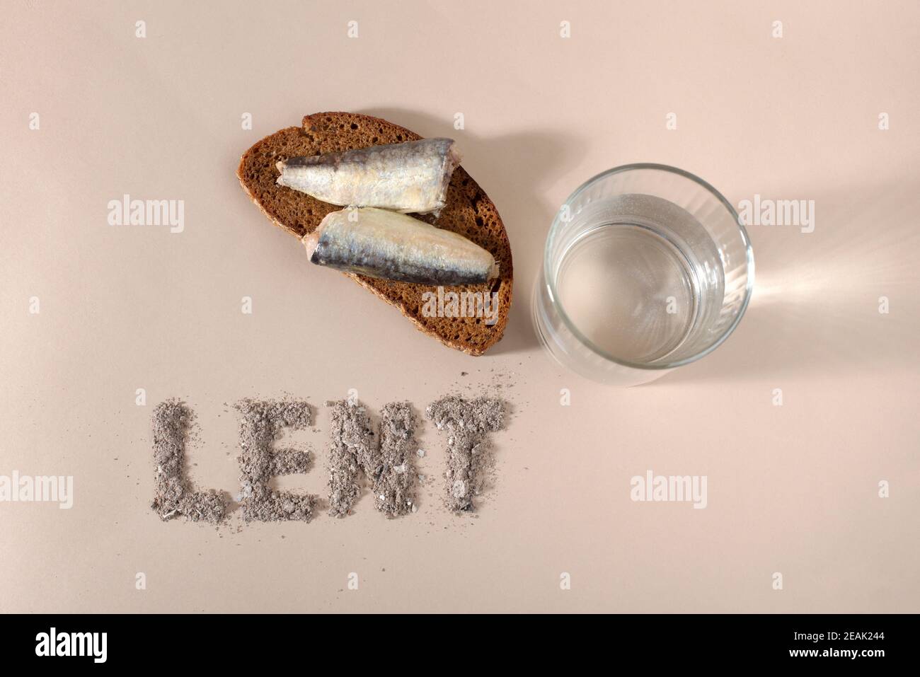Lent Season, Holy Week and Good Friday concept - water, bread, fish and ...