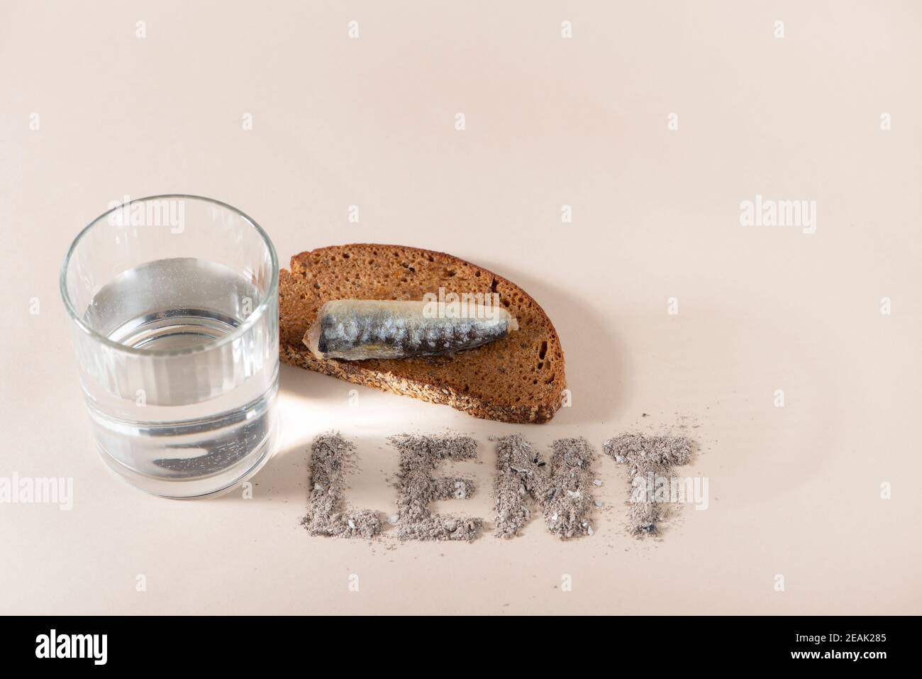 Lent Season, Holy Week and Good Friday concept - water, bread, fish and ...