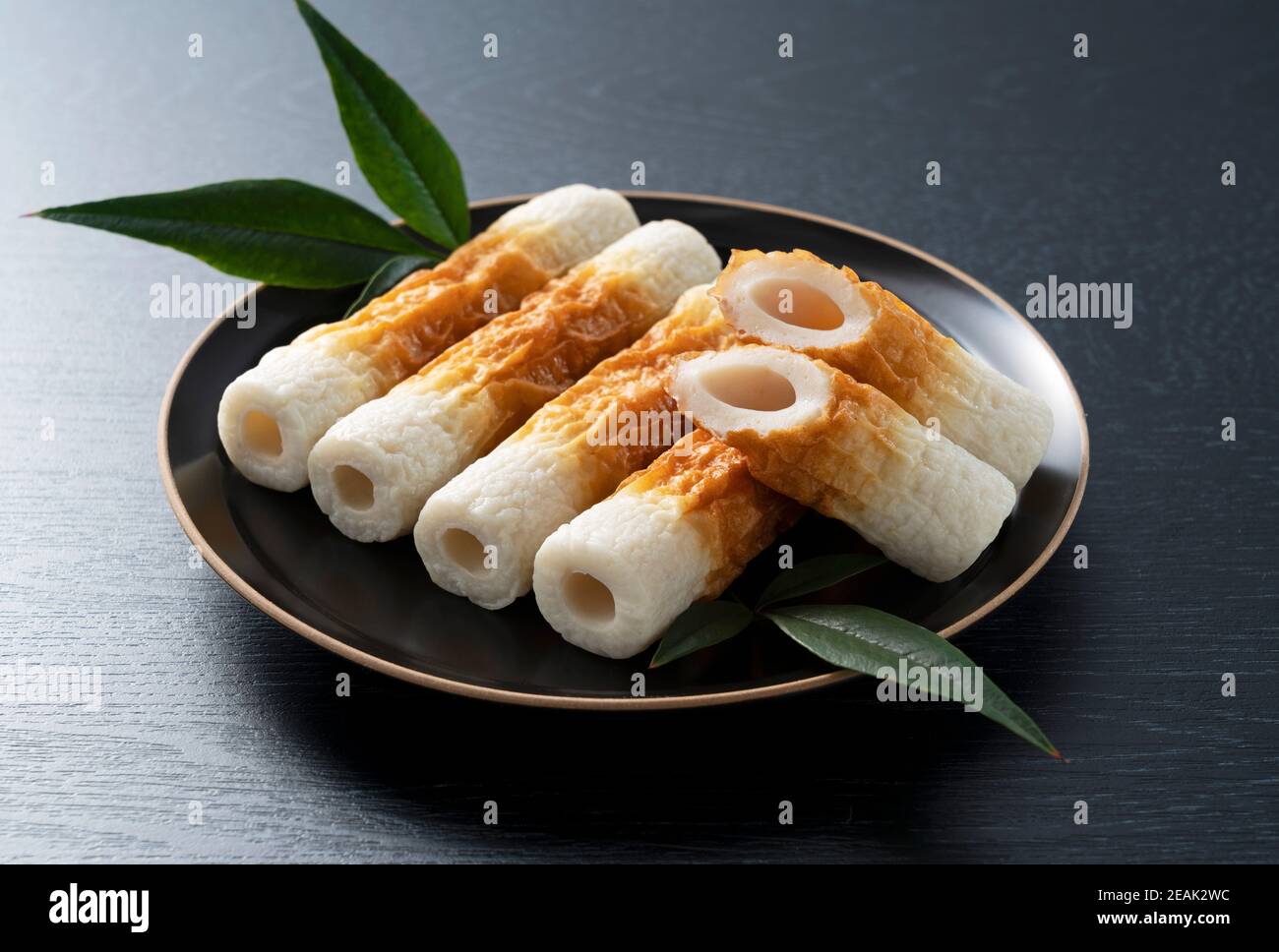 Japanese chikuwa placed on a black background Stock Photo - Alamy