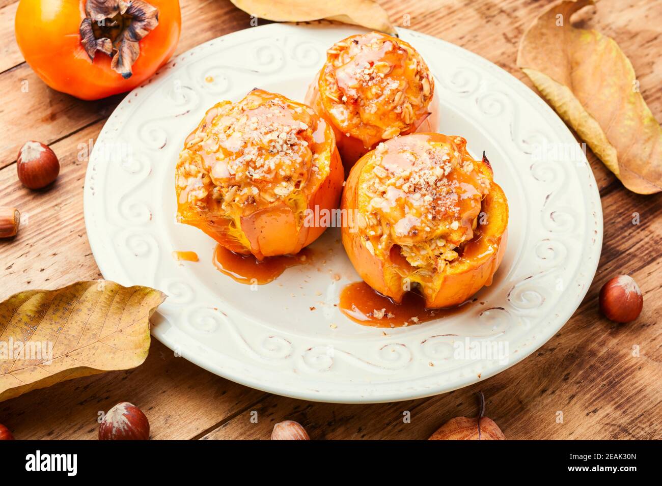 Baked persimmon with caramel Stock Photo - Alamy