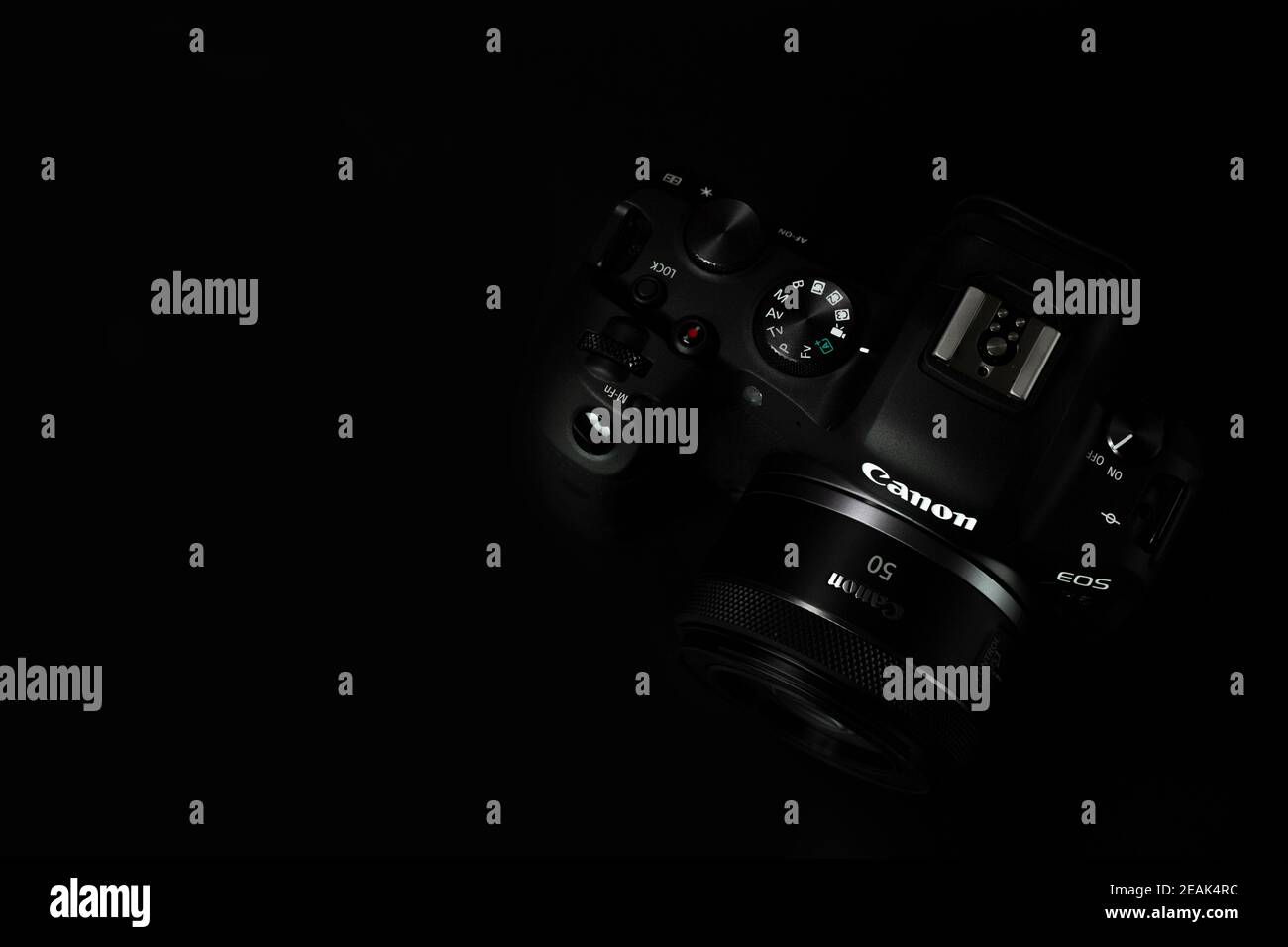 Canon r6 digital camera close-up, black background, glare Stock Photo ...