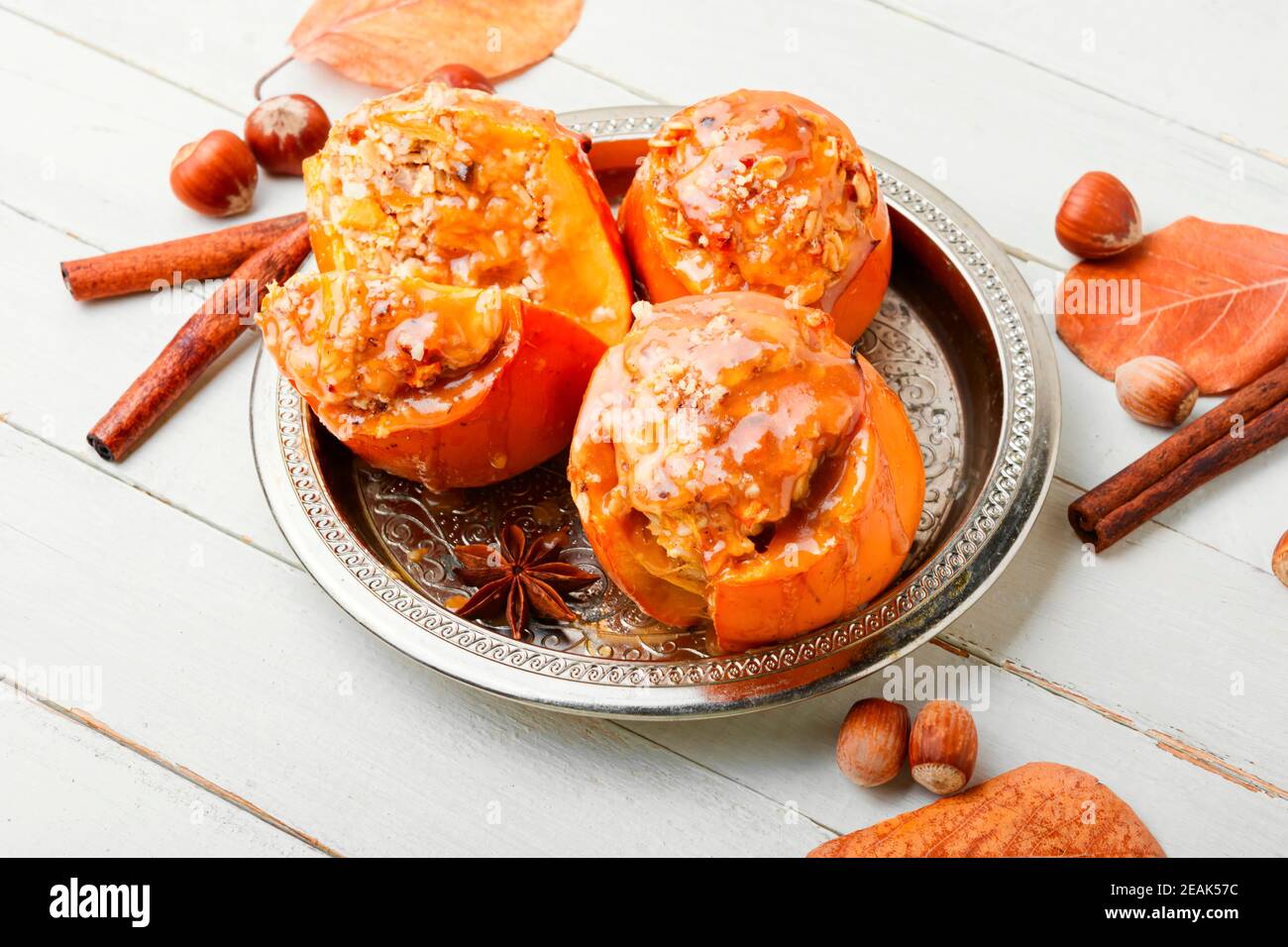 Baked persimmon with granola Stock Photo - Alamy