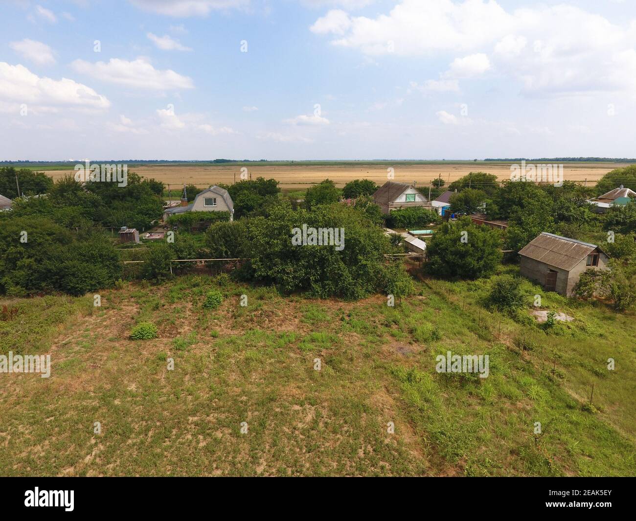 The village is in summer view from above. Cottages of summer residents ...