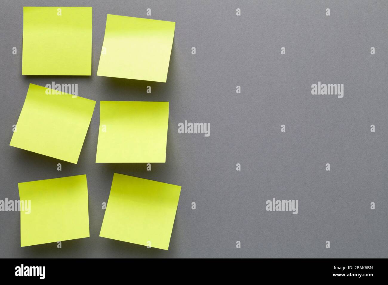 Yellow Sticky Notes On Grey Paper Background Stock Photo - Alamy