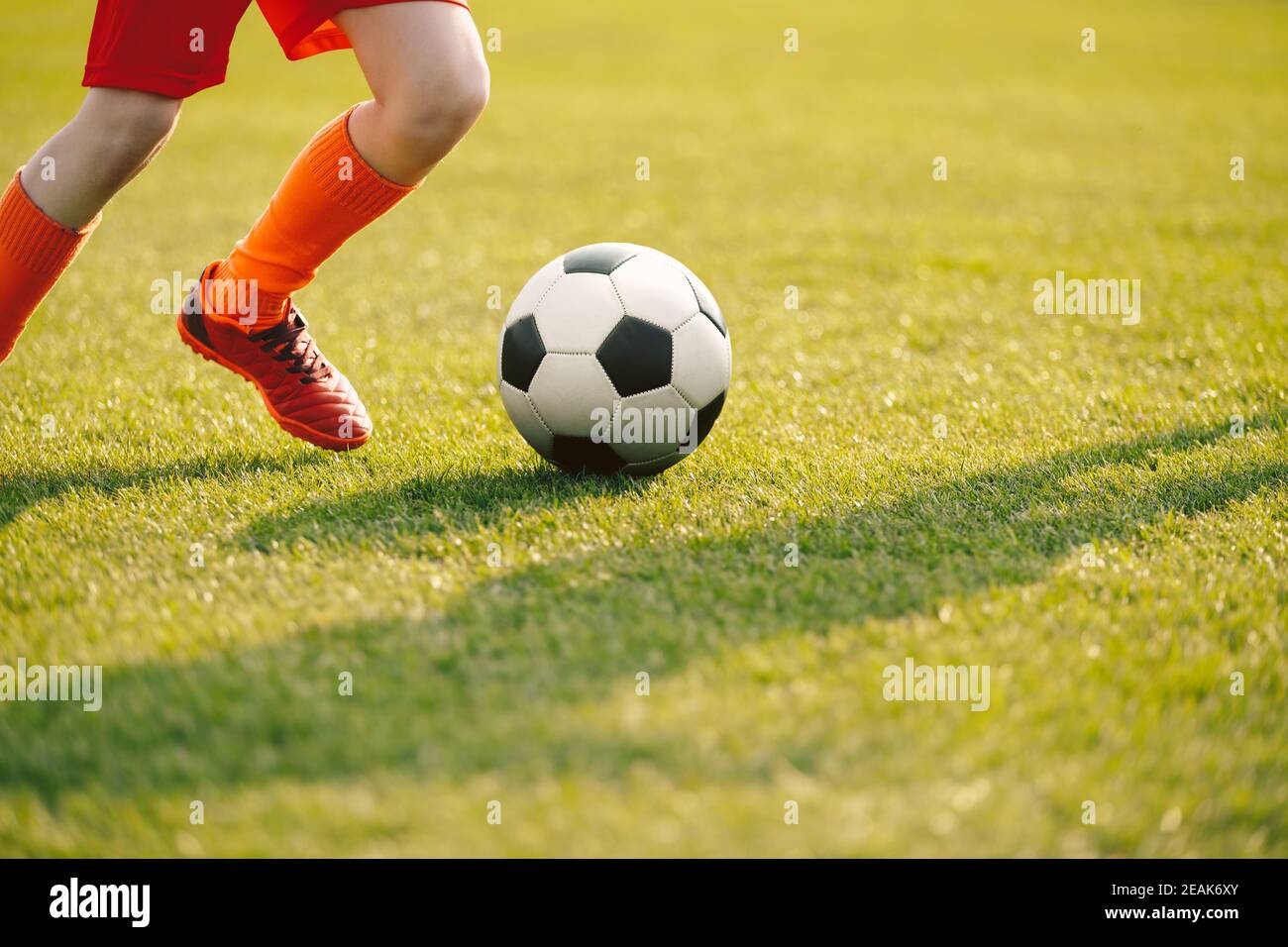 Footballer dribbling ball hi-res stock photography and images - Alamy
