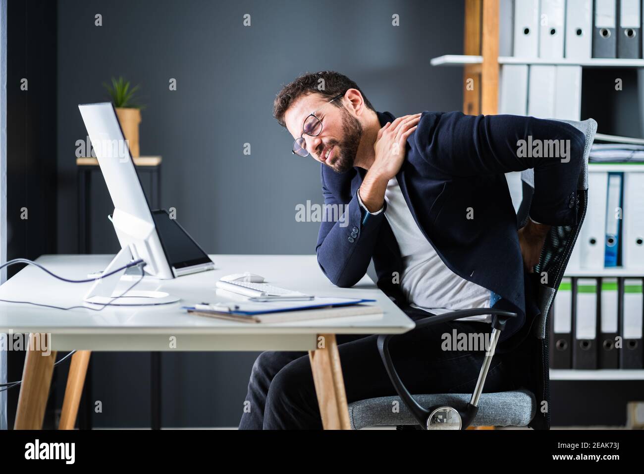 Desk sit back ache hi-res stock photography and images - Alamy