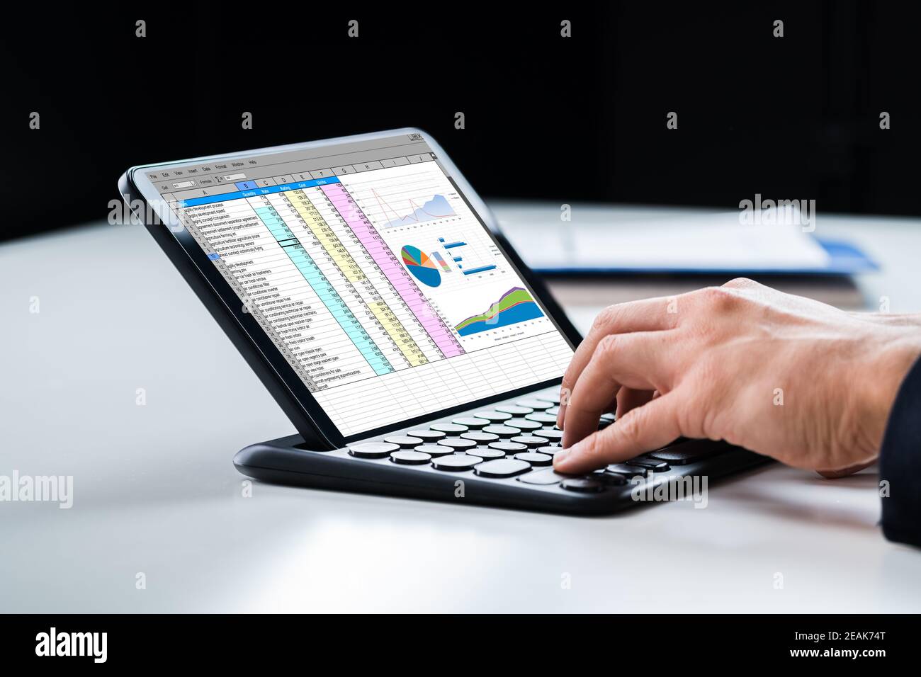 Analyst Using Spreadsheet Report On Tablet Stock Photo - Alamy