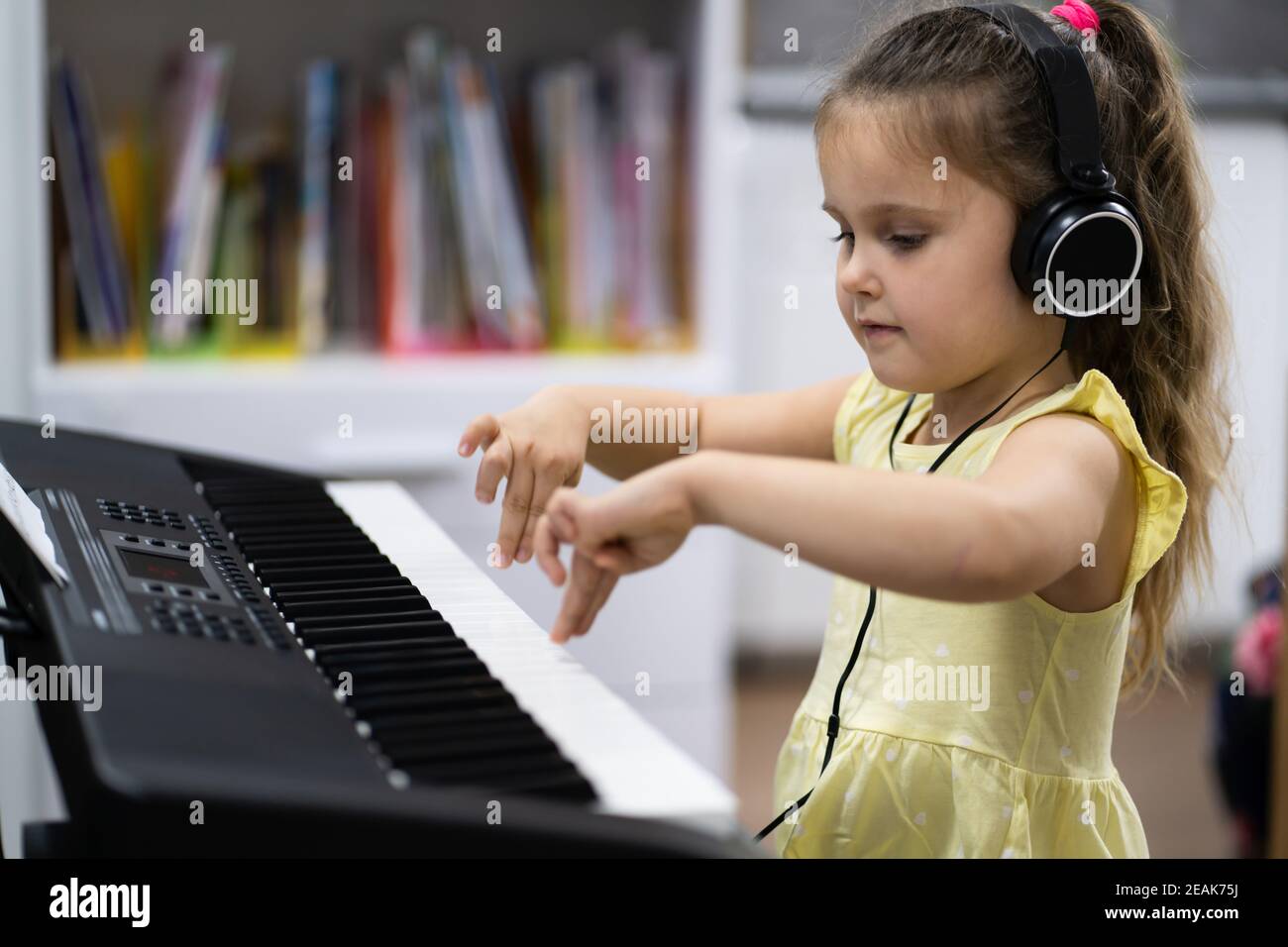 Child Girl Playing Music Keyboard Piano Stock Photo - Alamy