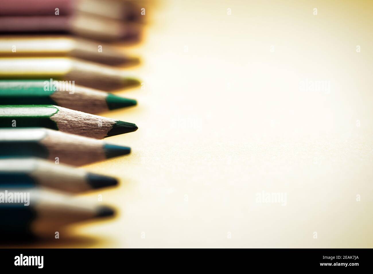 Color pencils in arrange in color in a row, Macro close-up with blurred ...