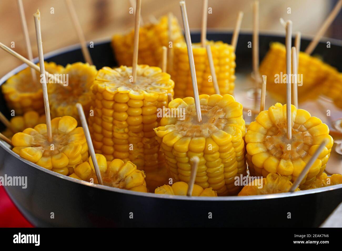 Closeup boiled cooked corn cobs on stick Stock Photo - Alamy