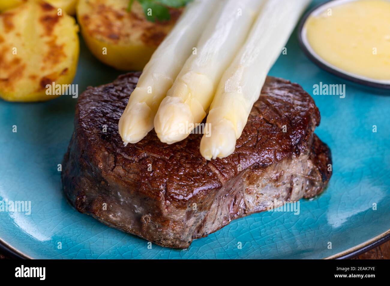 asparagus with potatoes and a steak Stock Photo - Alamy