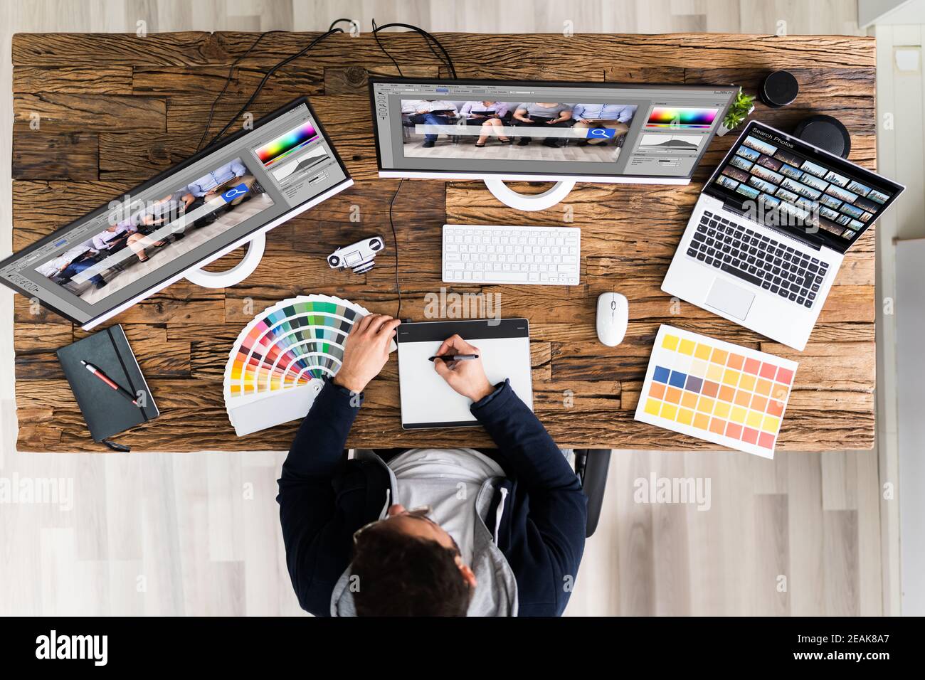 Designer Editing Photos Stock Photo - Alamy