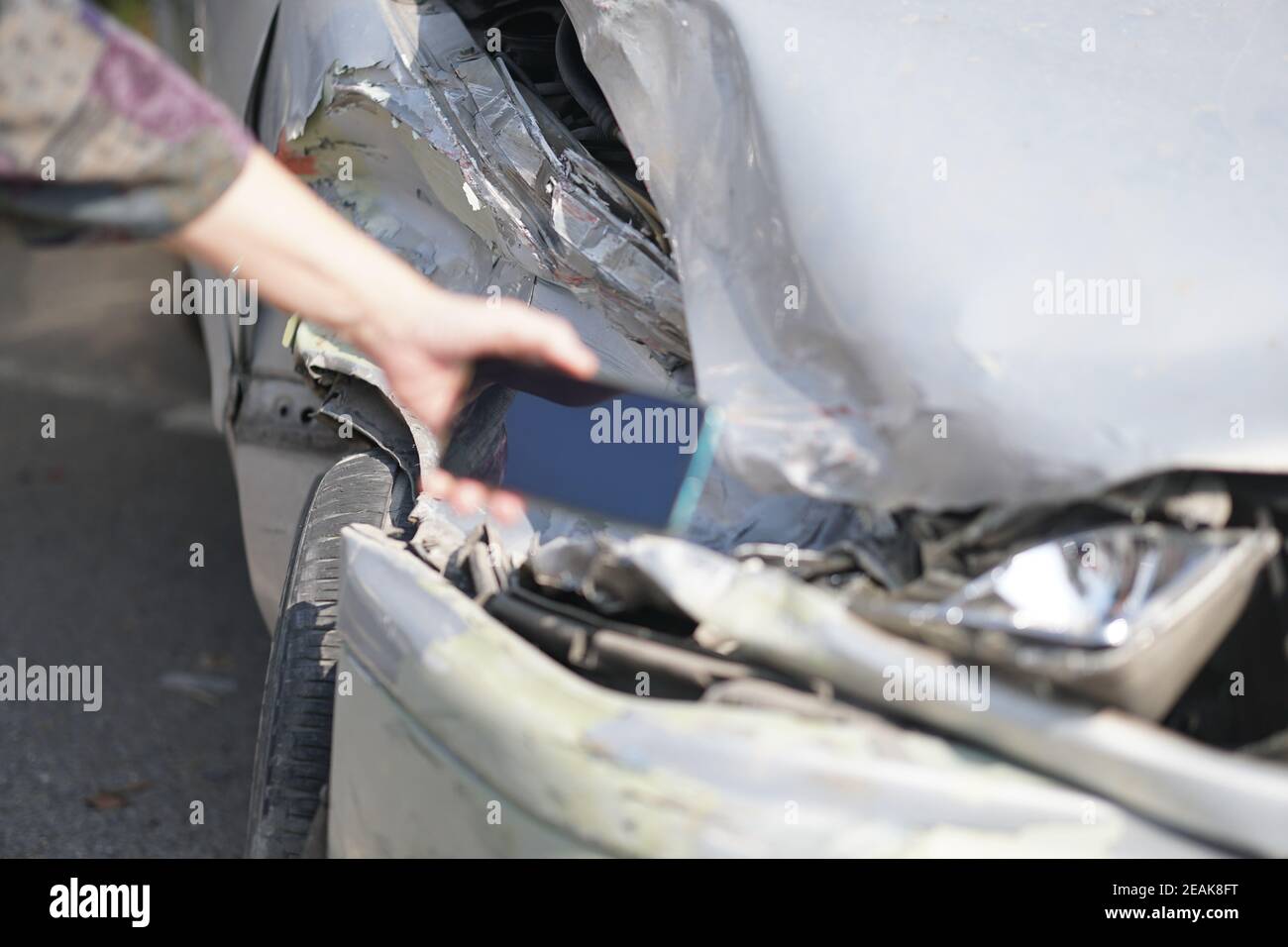 hand take photo of crashed damaged broken car. automobile crash ...