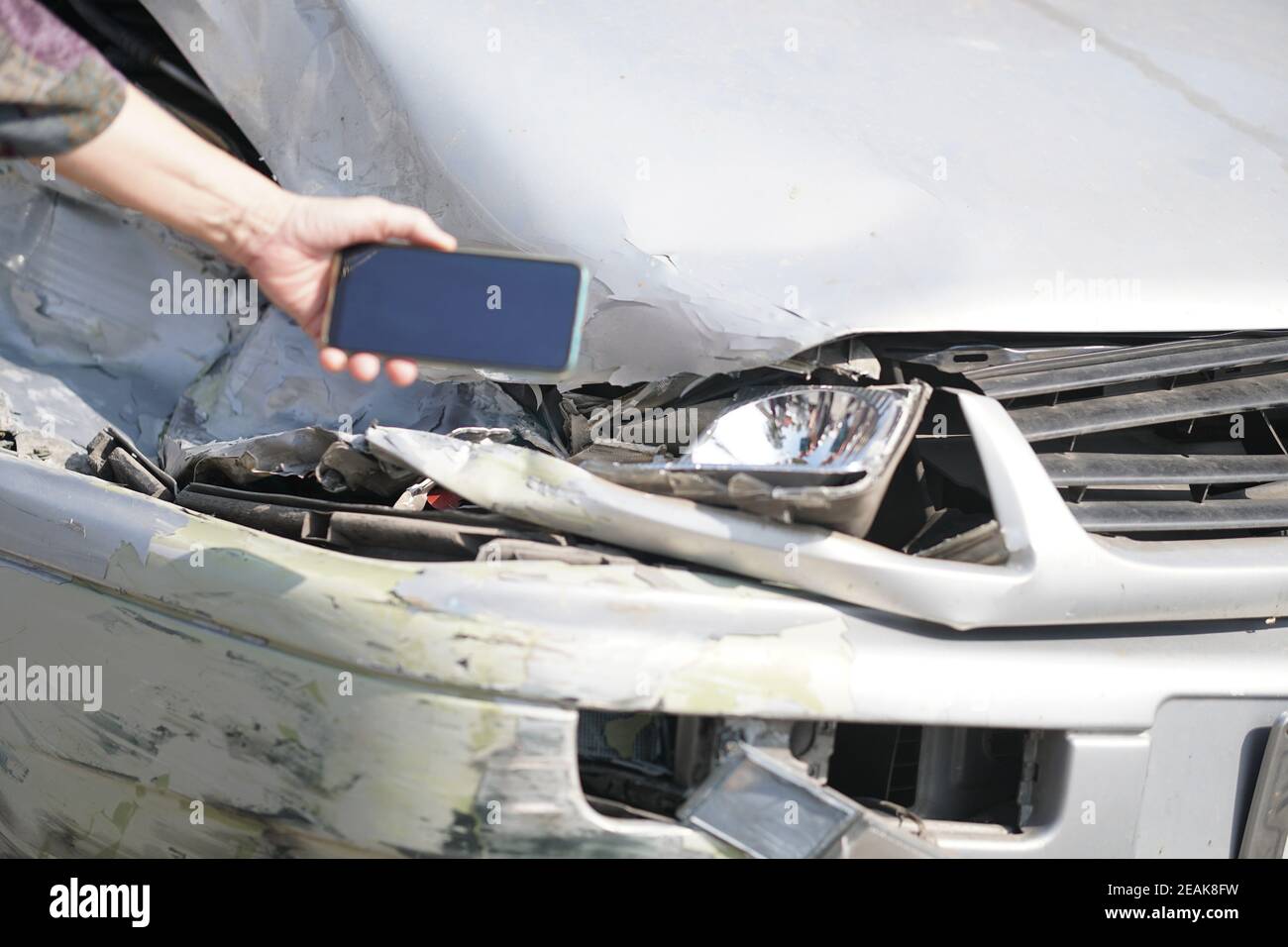 hand take photo of crashed damaged broken car. automobile crash ...