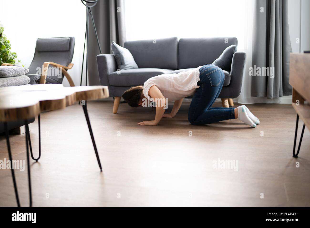 Woman looking lost keys hi-res stock photography and images - Alamy