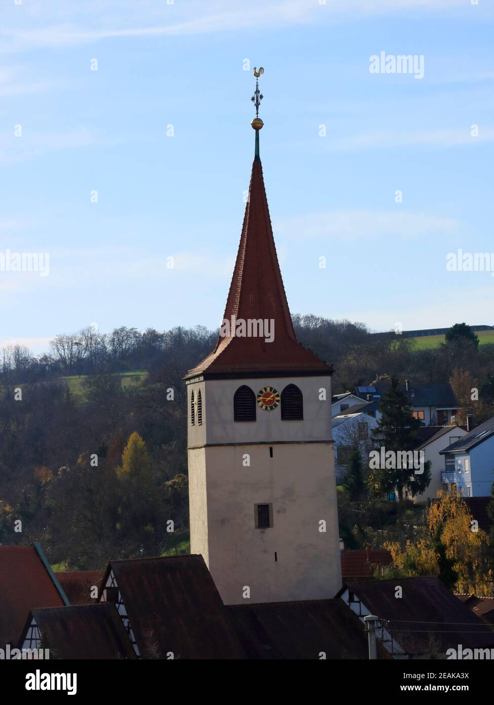 view of the historic church tower in the village of Weissach in the ...