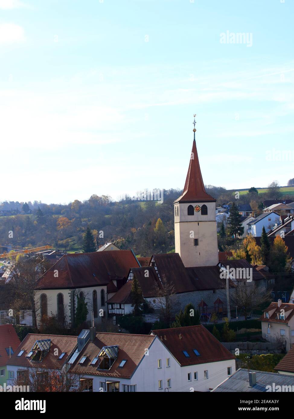 view of the historic church tower in the village of Weissach in the ...