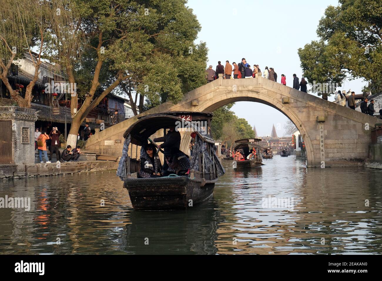 Tourist boats on the water canals of Xitang Town in Zhejiang Province ...