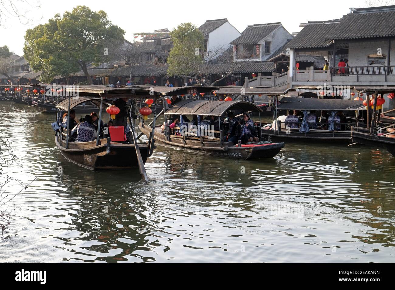 Tourist boats on the water canals of Xitang Town in Zhejiang Province ...