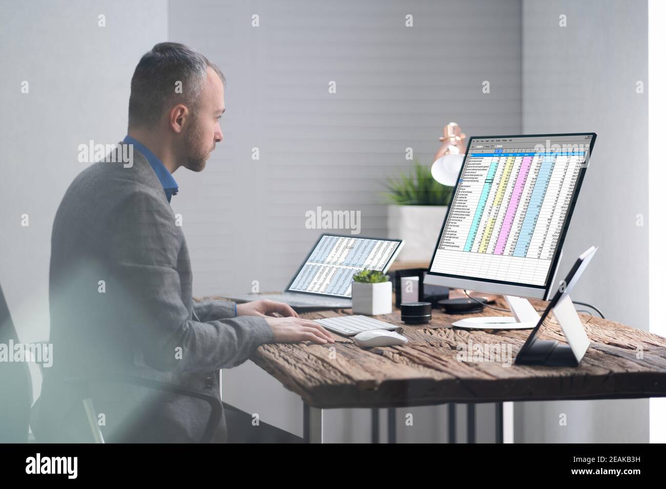 Analyst Employee Working With Spreadsheet Stock Photo - Alamy