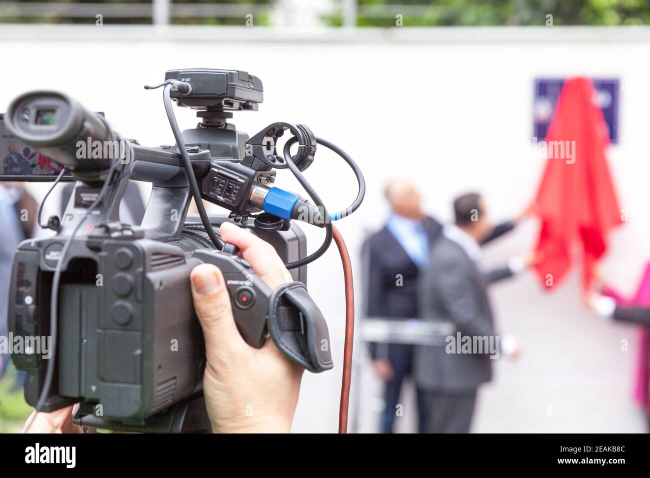 Filming media event with a video camera Stock Photo - Alamy