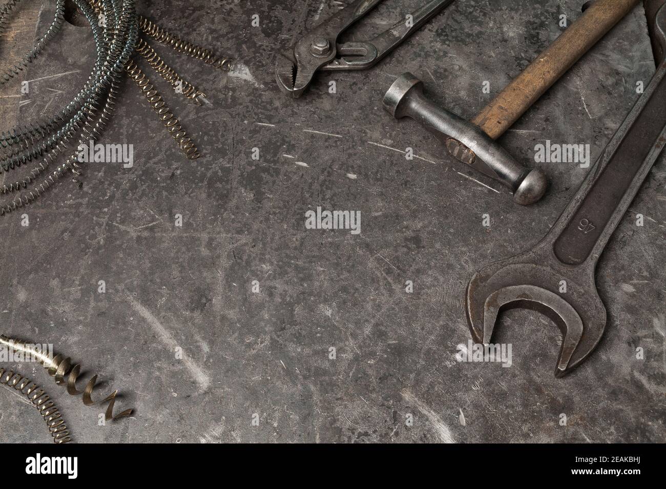 Old tools set on a vintage metallic background with space for text ...