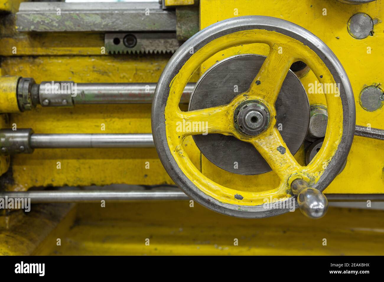 Old yellow lathe machine with a lot of handles Stock Photo - Alamy