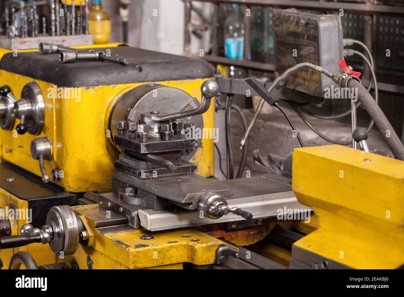 Old yellow lathe machine with a lot of handles Stock Photo - Alamy
