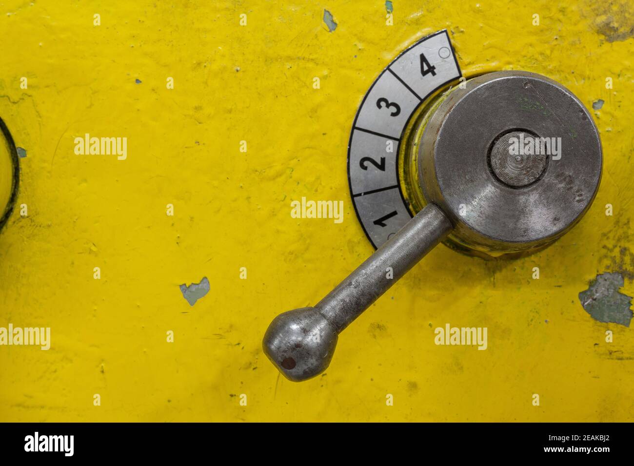 Old yellow lathe machine with a lot of handles Stock Photo - Alamy