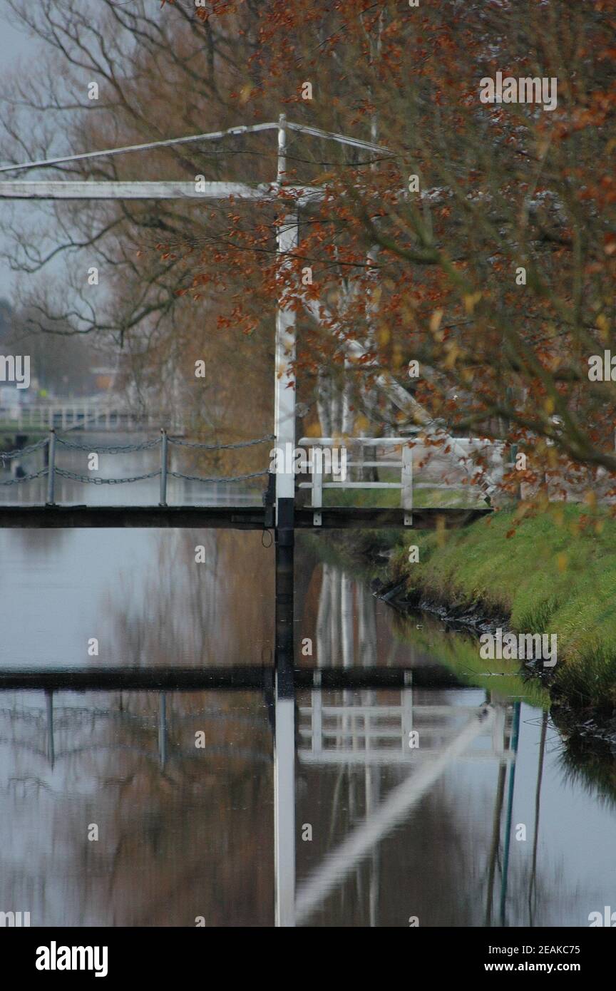 boats and mills in the german eastern frisia Stock Photo - Alamy