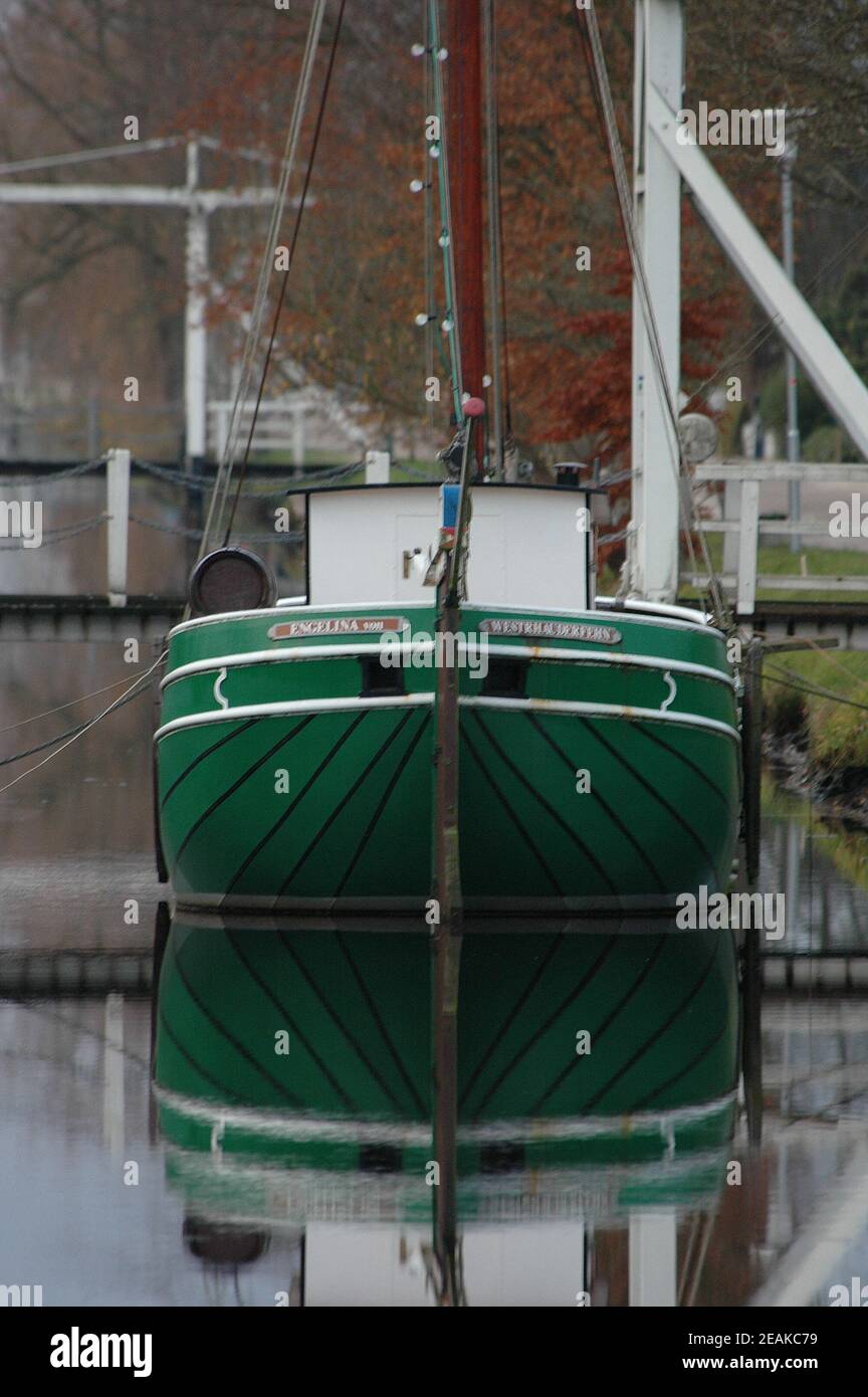 boats and mills in the german eastern frisia Stock Photo - Alamy