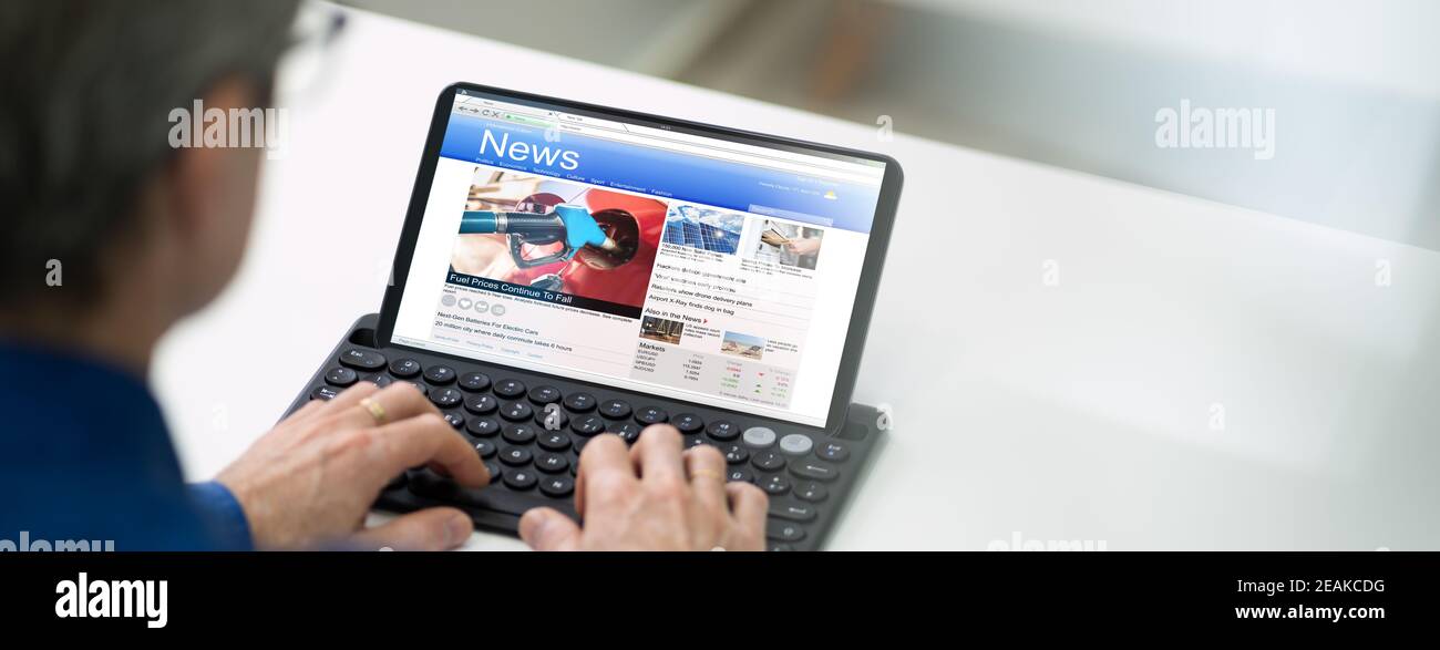 Online Newspaper On Tablet Computer Stock Photo - Alamy