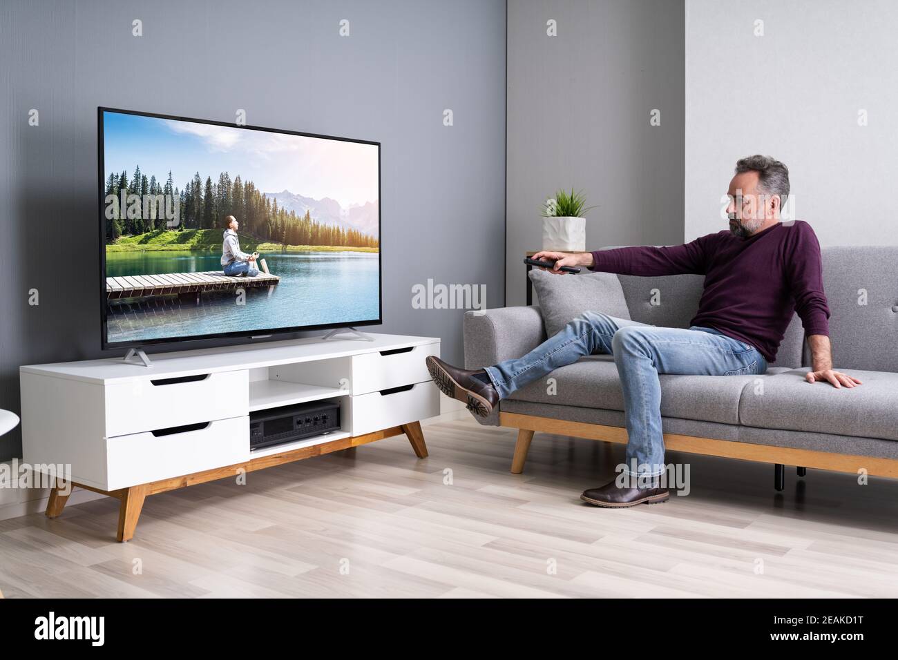 Elderly Man Streaming And Watching Movie Stock Photo - Alamy