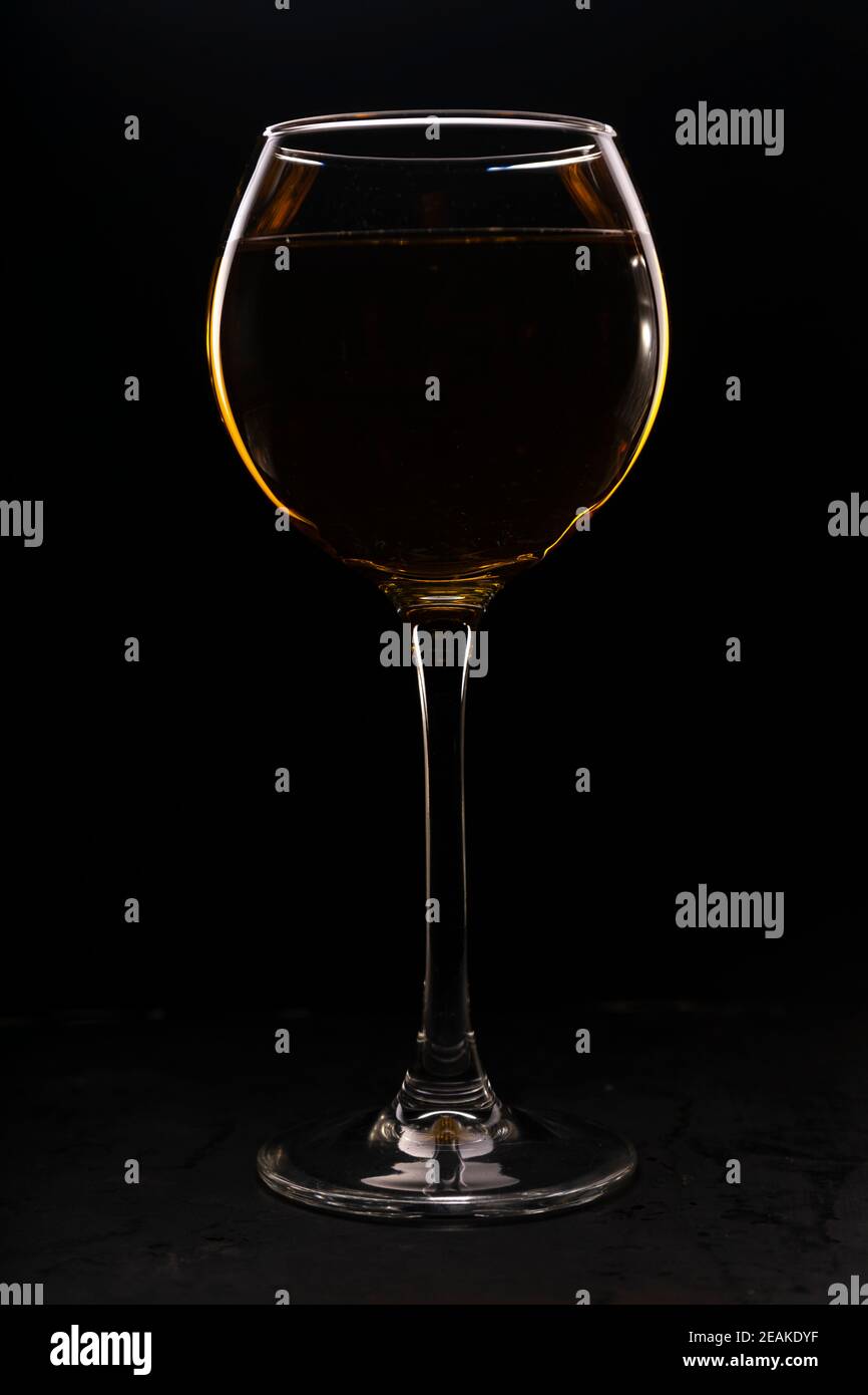 amber or orange wine made from white grapes. in a tall wine glass ...