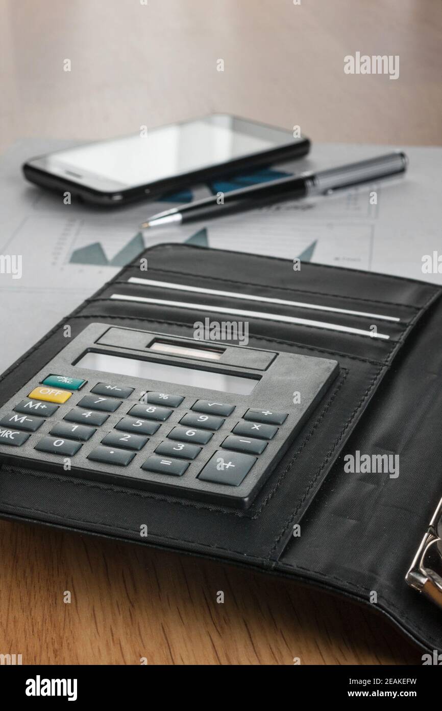 Work in office, desk concept with calculator and phone Stock Photo - Alamy