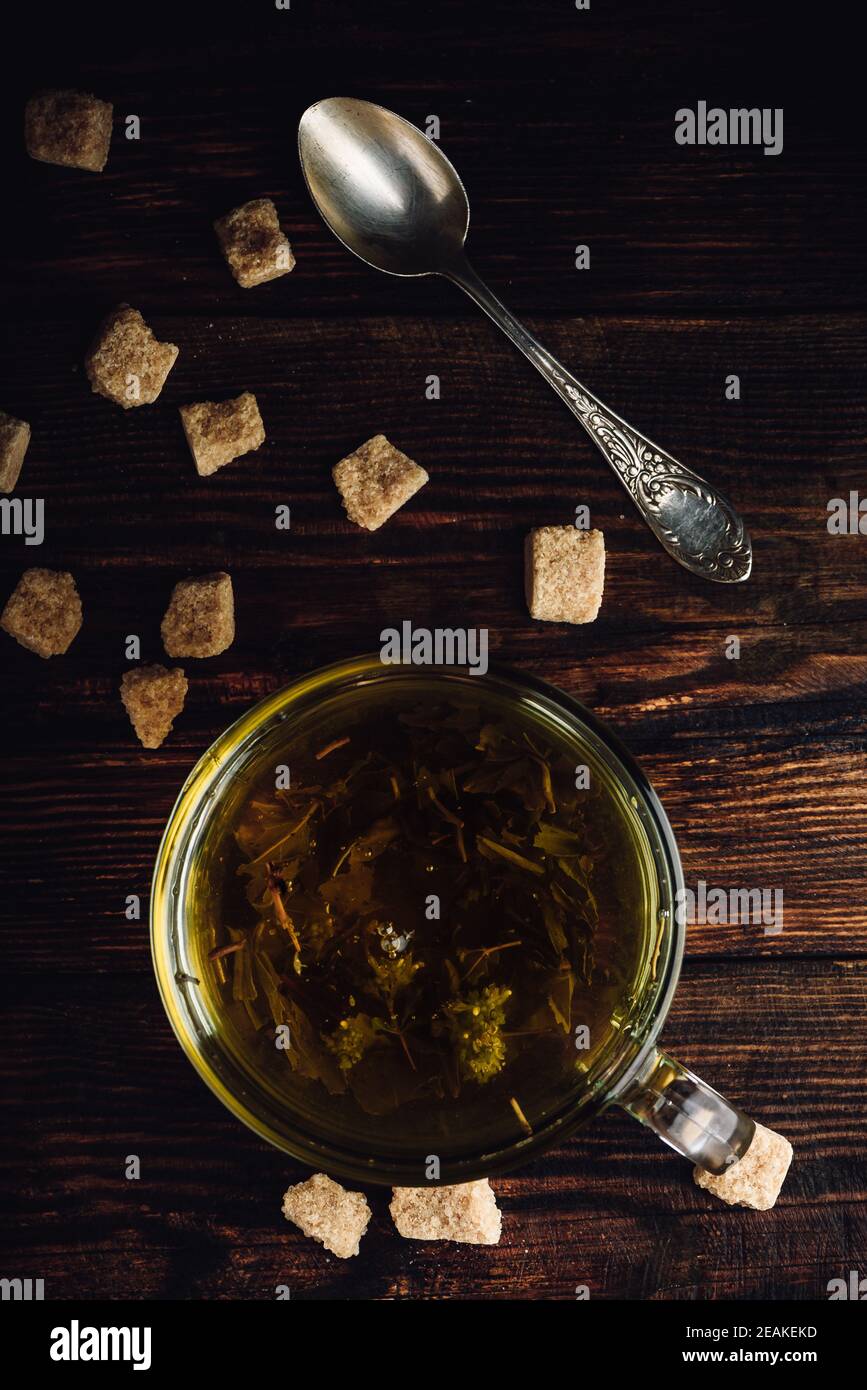 Cup of green tea with brown tea sugar Stock Photo - Alamy